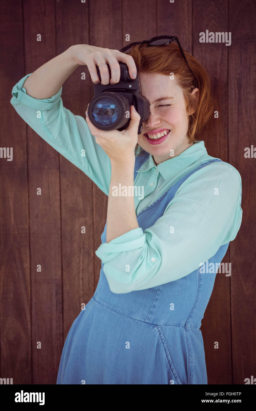 Red haired hipster taking picture Stock Photo - Alamy