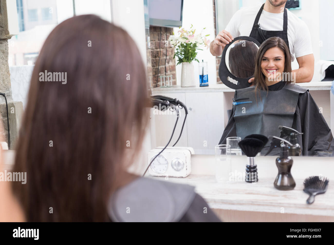 Pretty brunette happy with her haircut Stock Photo - Alamy