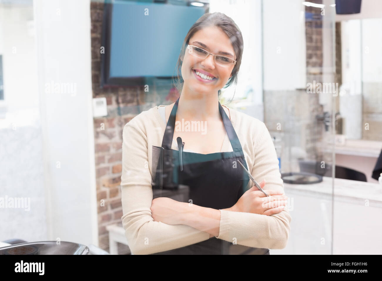 Hair stylist smiling at camera Stock Photo - Alamy