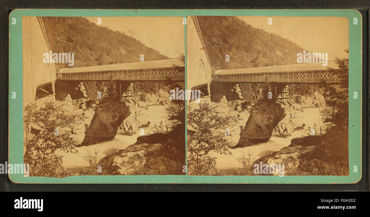 A photograph by P. W. Taft showing the view between two bridges at a waterfall, highlighting the ...