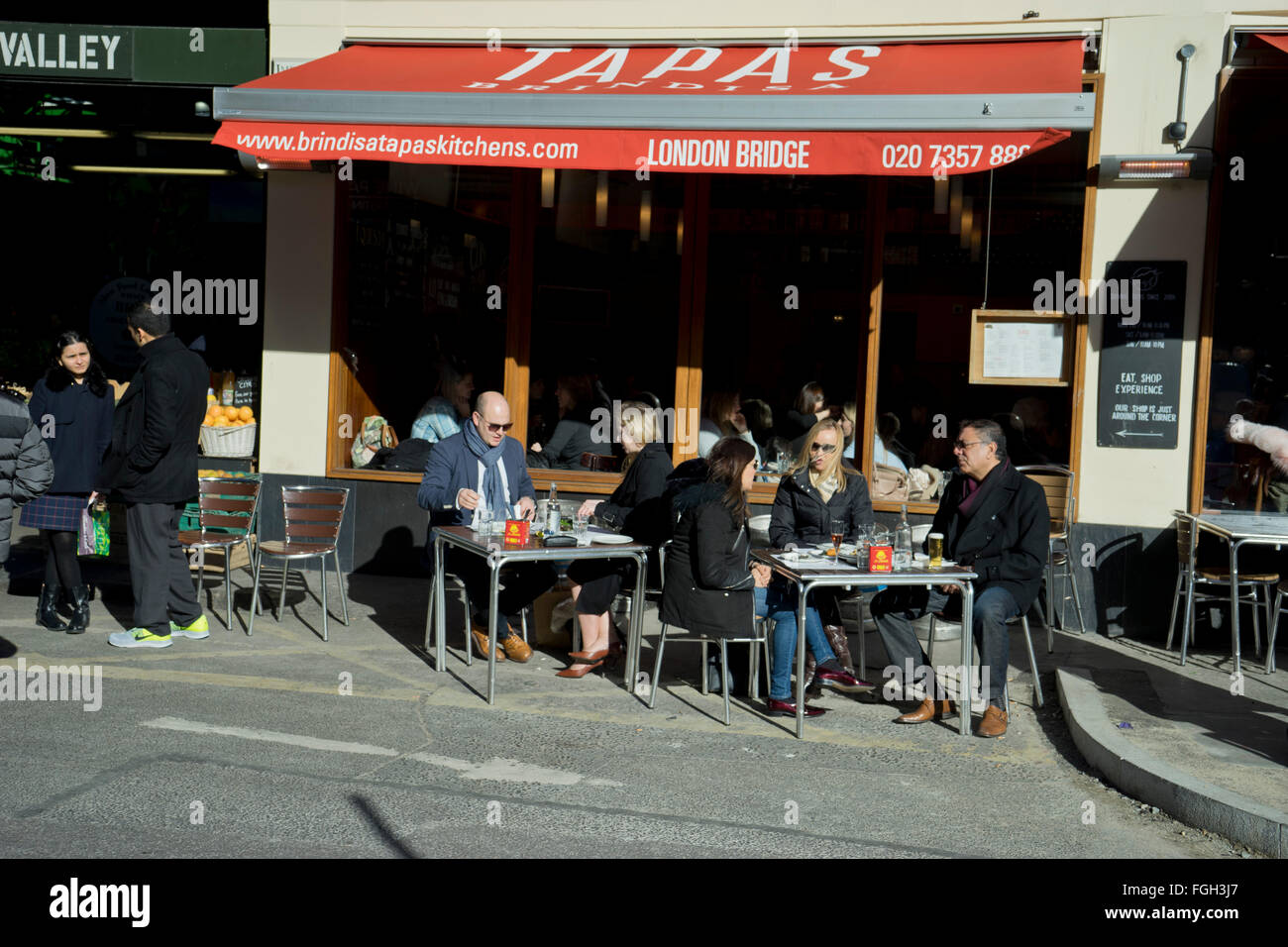 People eating at restaurant and tapas bar in Borough Market, London, UK ...