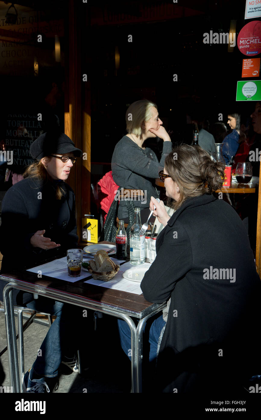 People eating at restaurant and tapas bar in Borough Market, London, UK ...