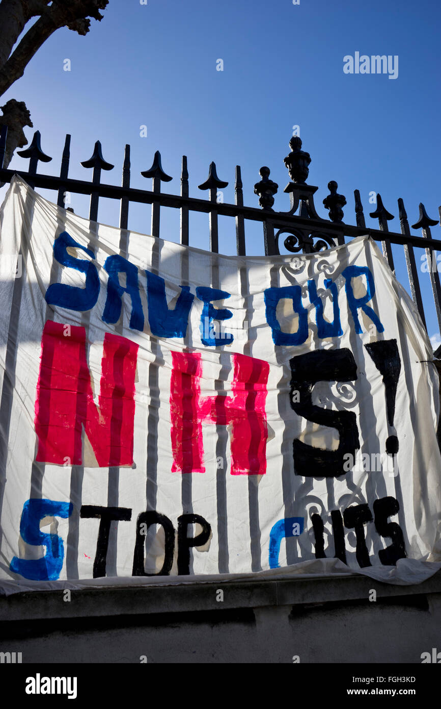 Banner with support against cuts in the budget of the NHS in London, UK ...