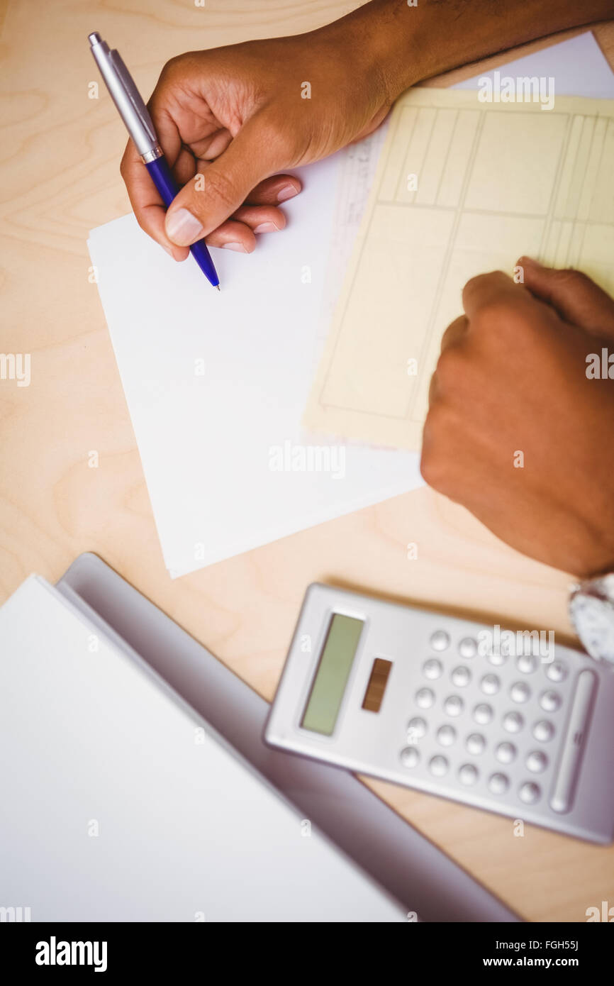 Hand writing documents at desk Stock Photo - Alamy
