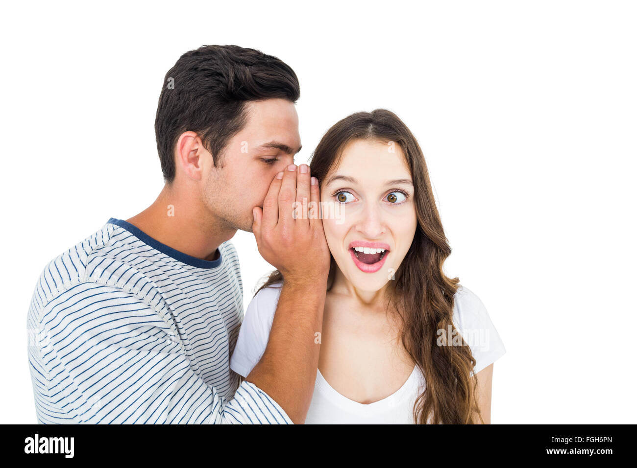 Young couple sharing a secret Stock Photo - Alamy