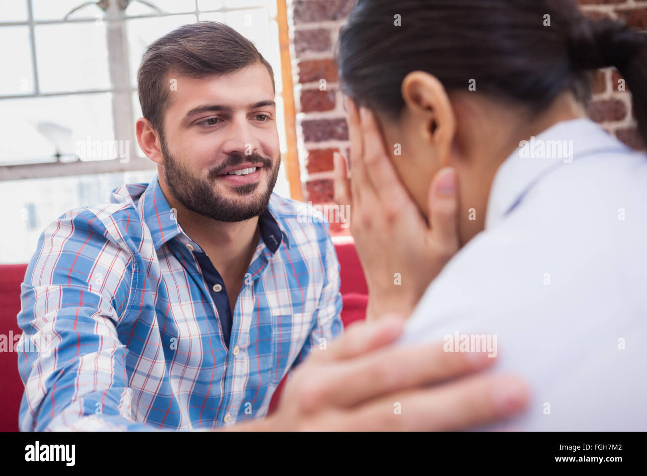 Therapist advising his crying patient Stock Photo - Alamy