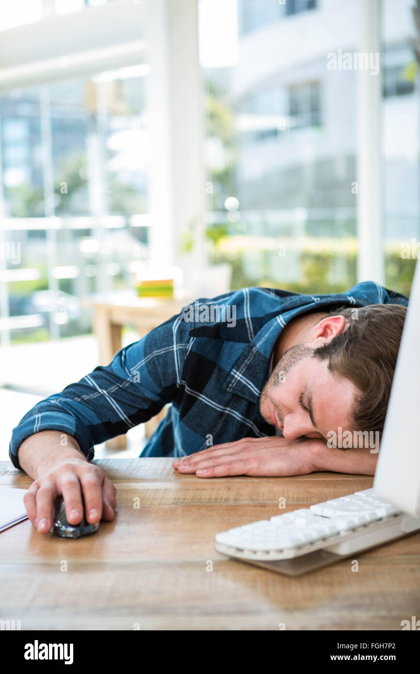 Handsome man sleeping on computer Stock Photo - Alamy