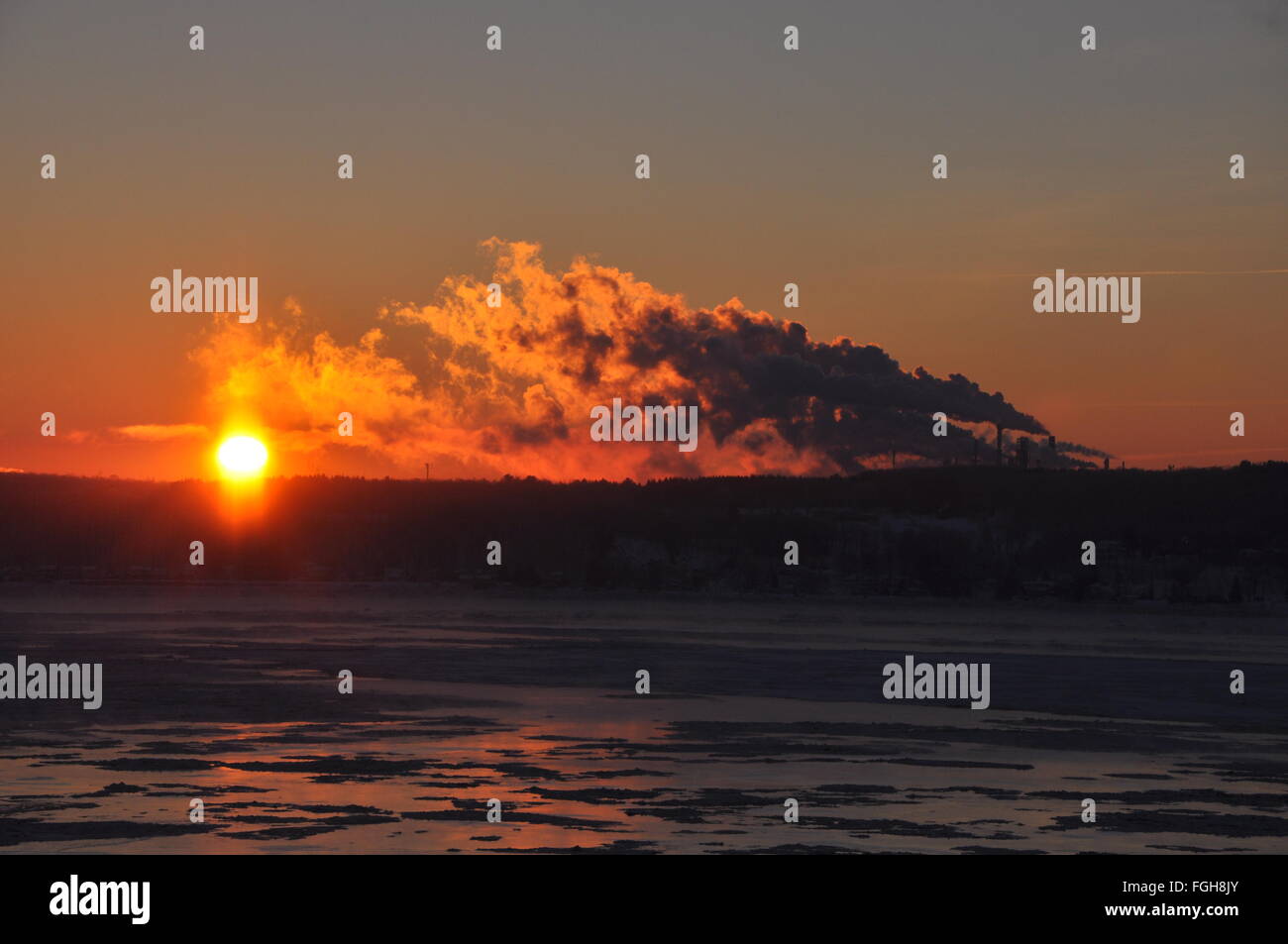 Sun in smoke Stock Photo - Alamy