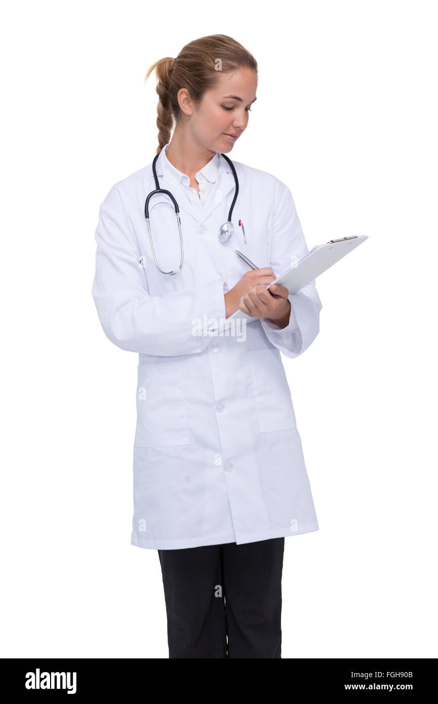 Smiling doctor taking down notes Stock Photo - Alamy