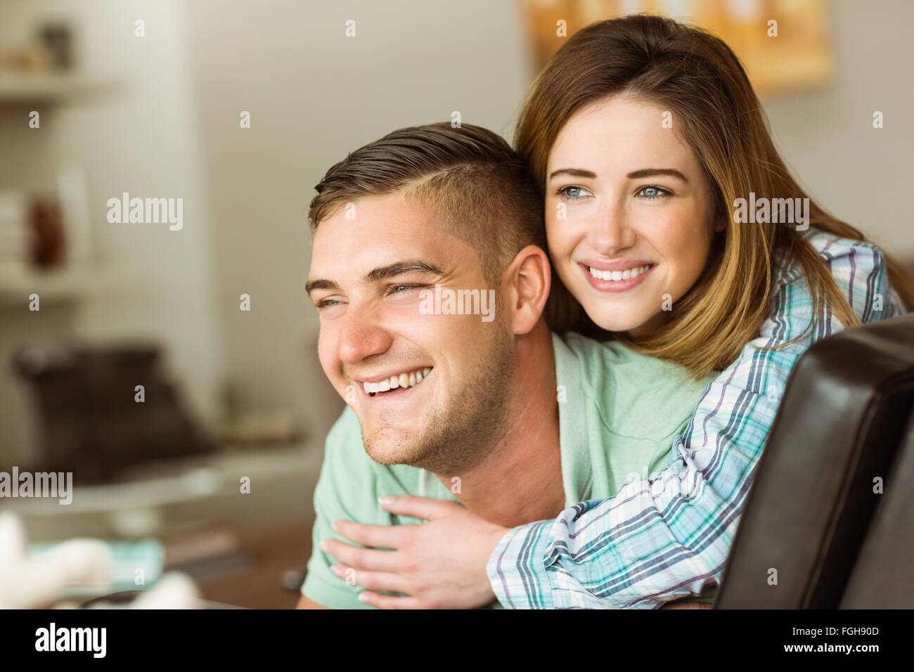 Cute couple relaxing on couch Stock Photo - Alamy