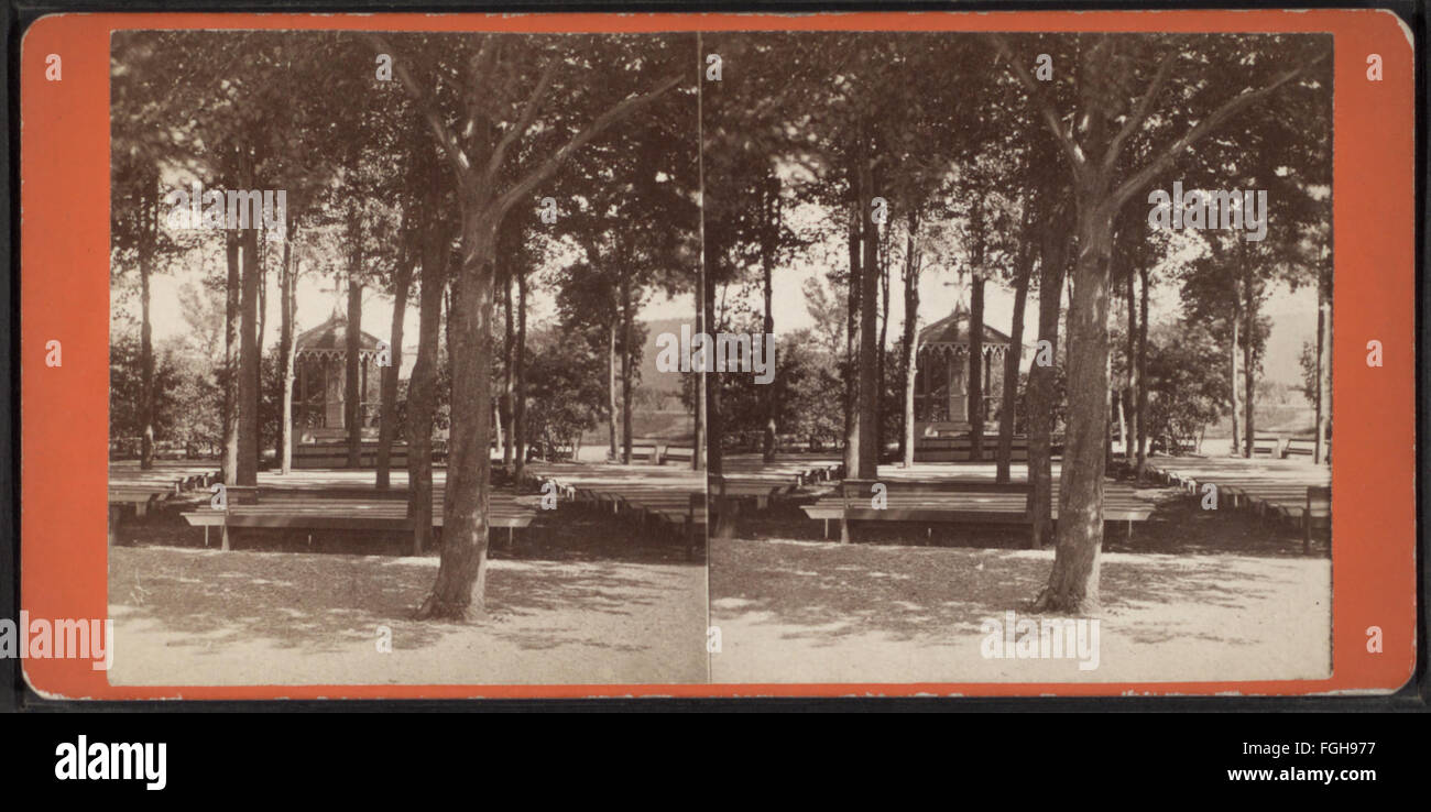 A photograph by J. H. Whitley showing the preaching stand and benches ...