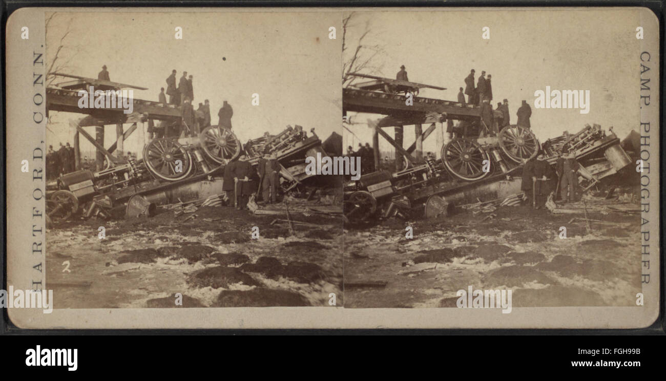 This photograph shows a train wreck, capturing the aftermath of the ...