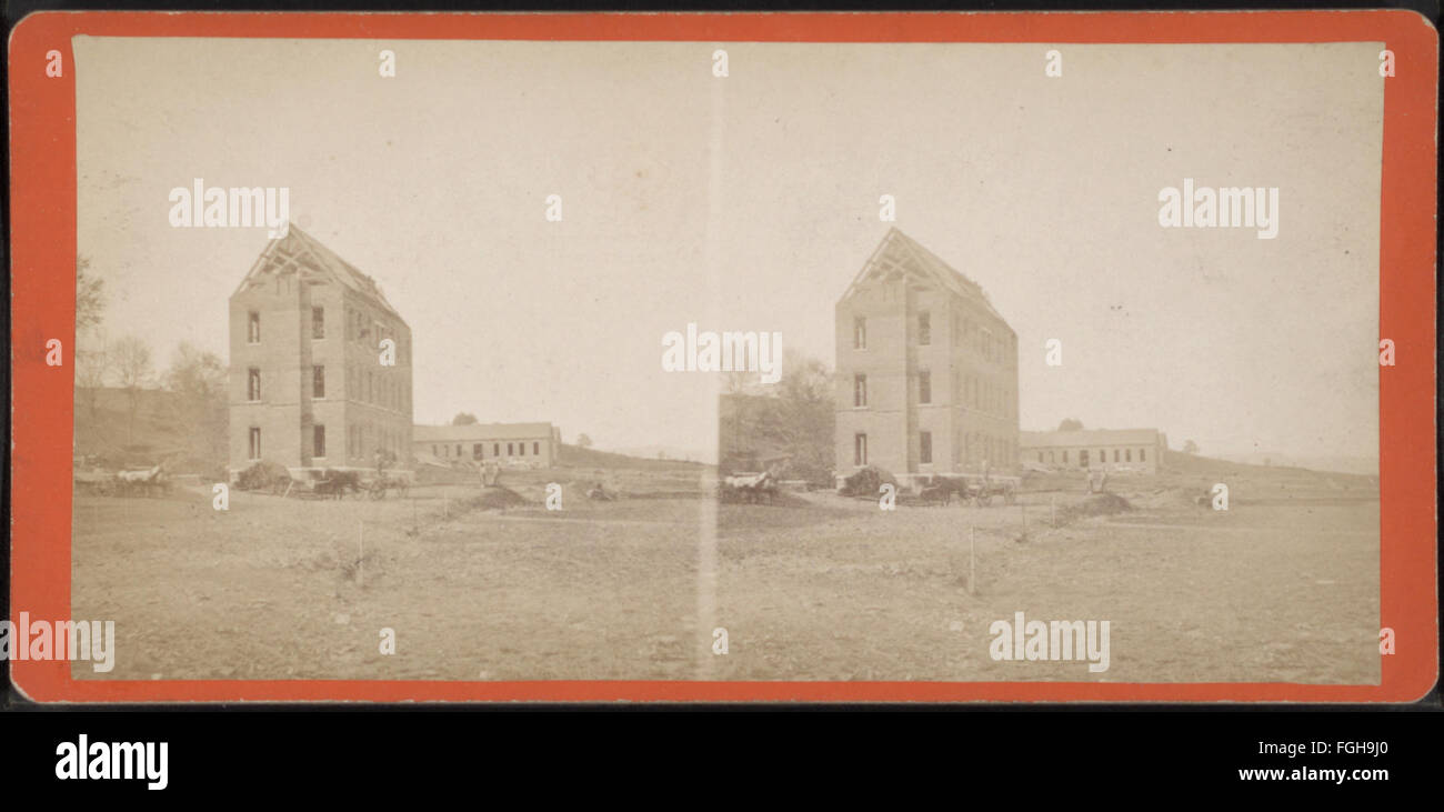 A photograph by Ackerman Bros depicting a building under construction ...