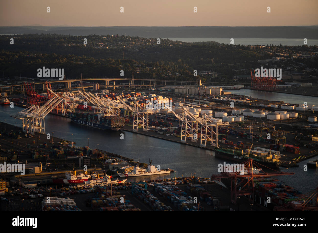 Retro image of Port of Seattle with large cranes in a row and loading ...