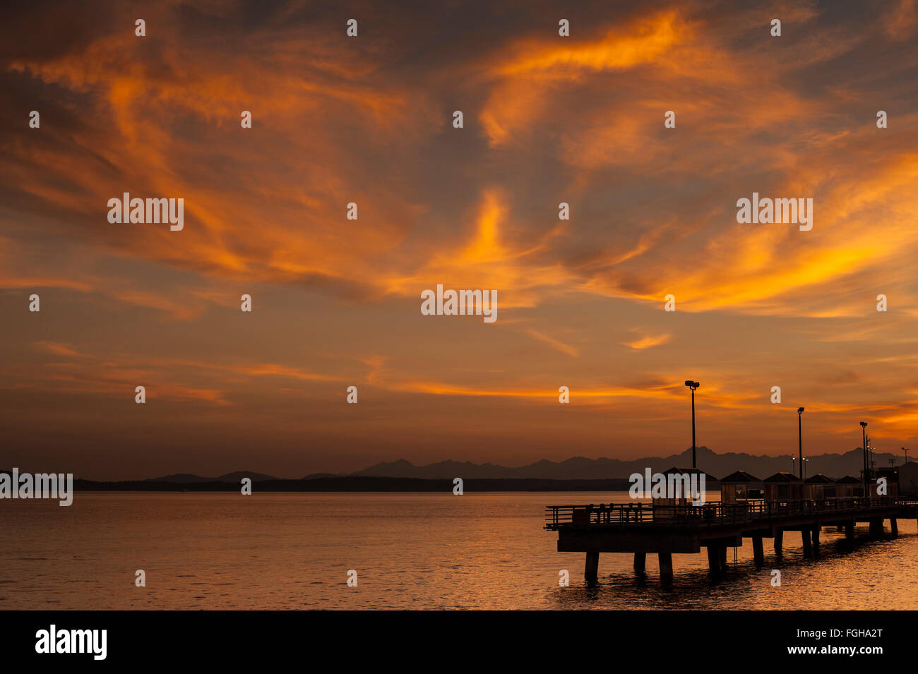 Dramatic sunset over Puget Sound and the Olympic Mountains with ...