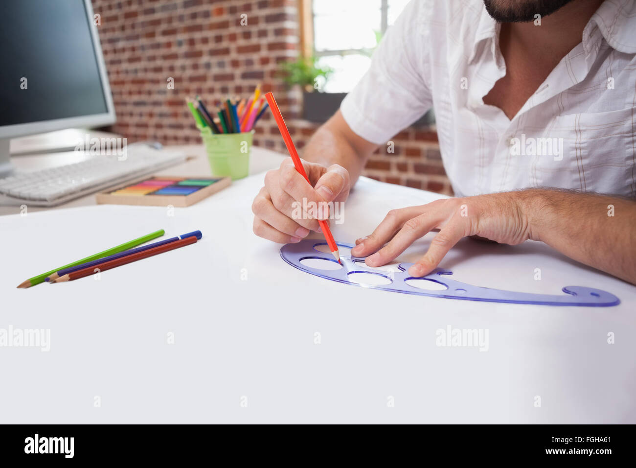 Designer drawing the old fashioned way Stock Photo - Alamy