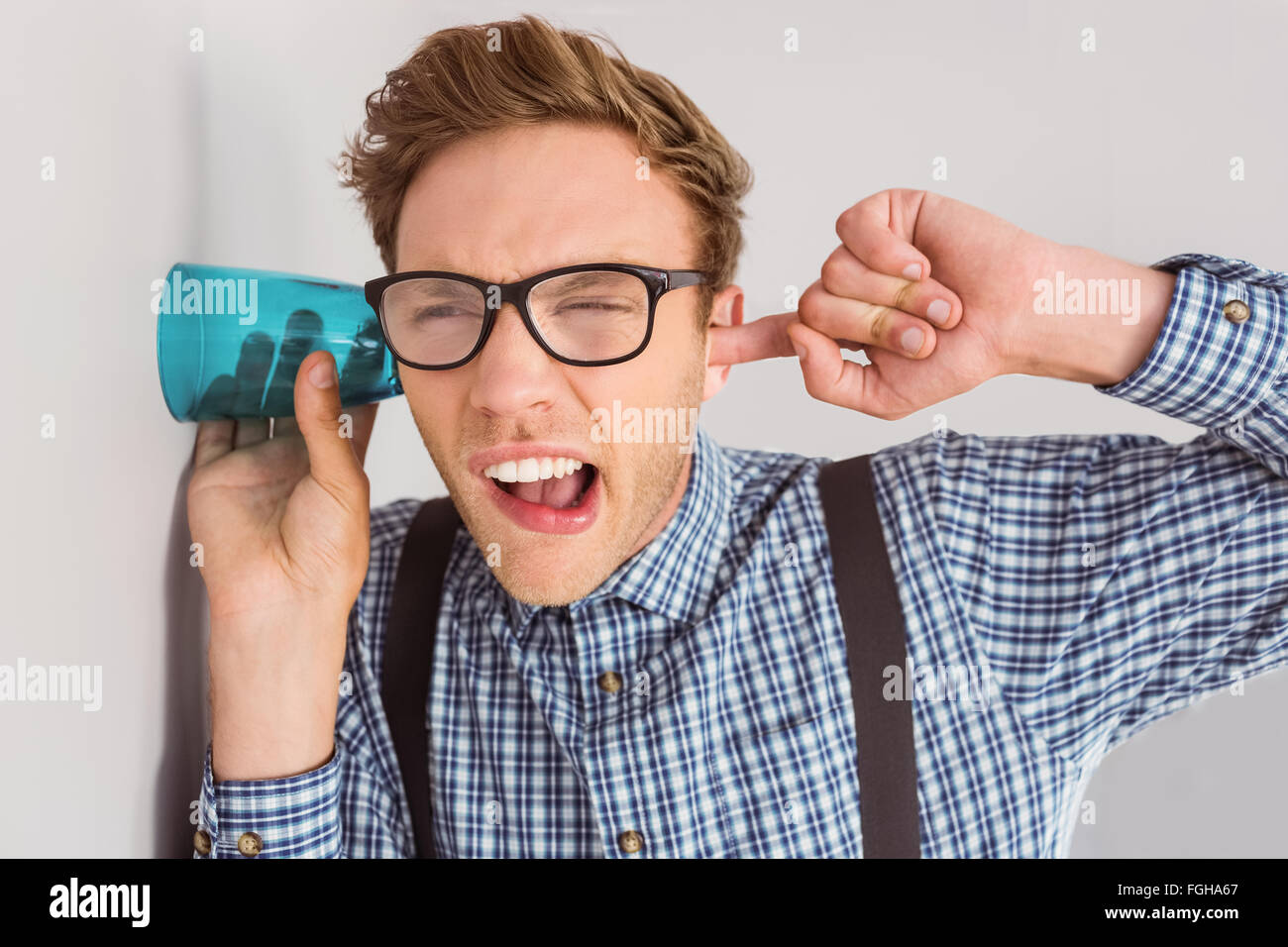 Geeky businessman eavesdropping cup hi-res stock photography and images ...