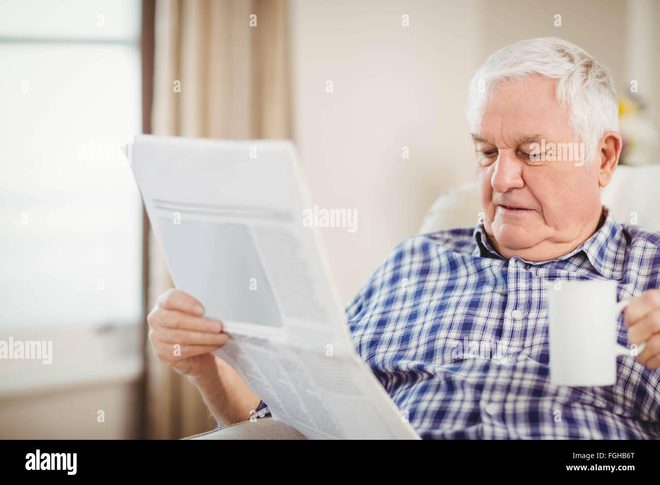 Old man reading newspaper in hi-res stock photography and images - Alamy