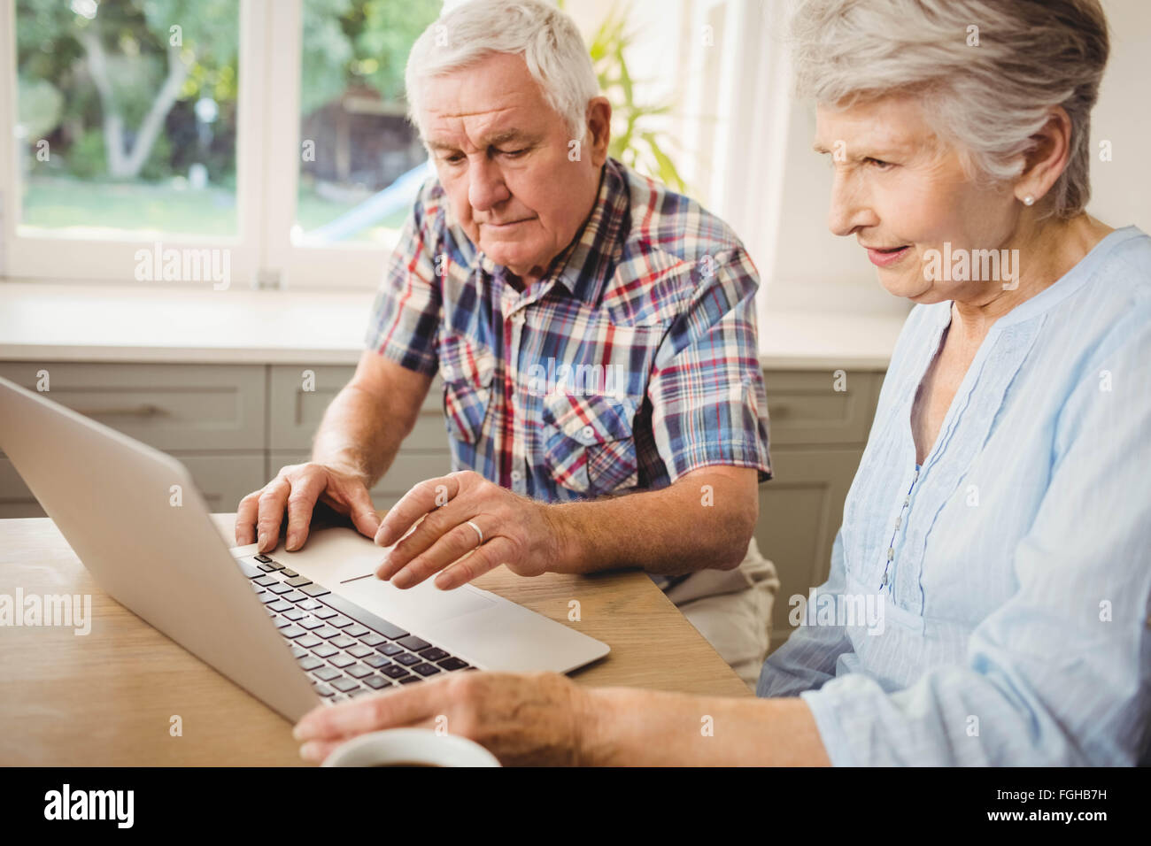 Elderly woman checking accounts hi-res stock photography and images - Alamy