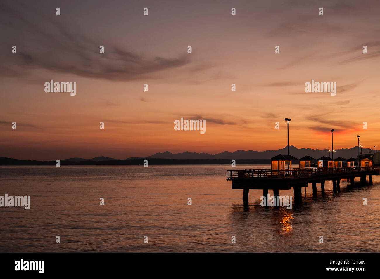 Dramatic sunset over Puget Sound and the Olympic Mountains with ...