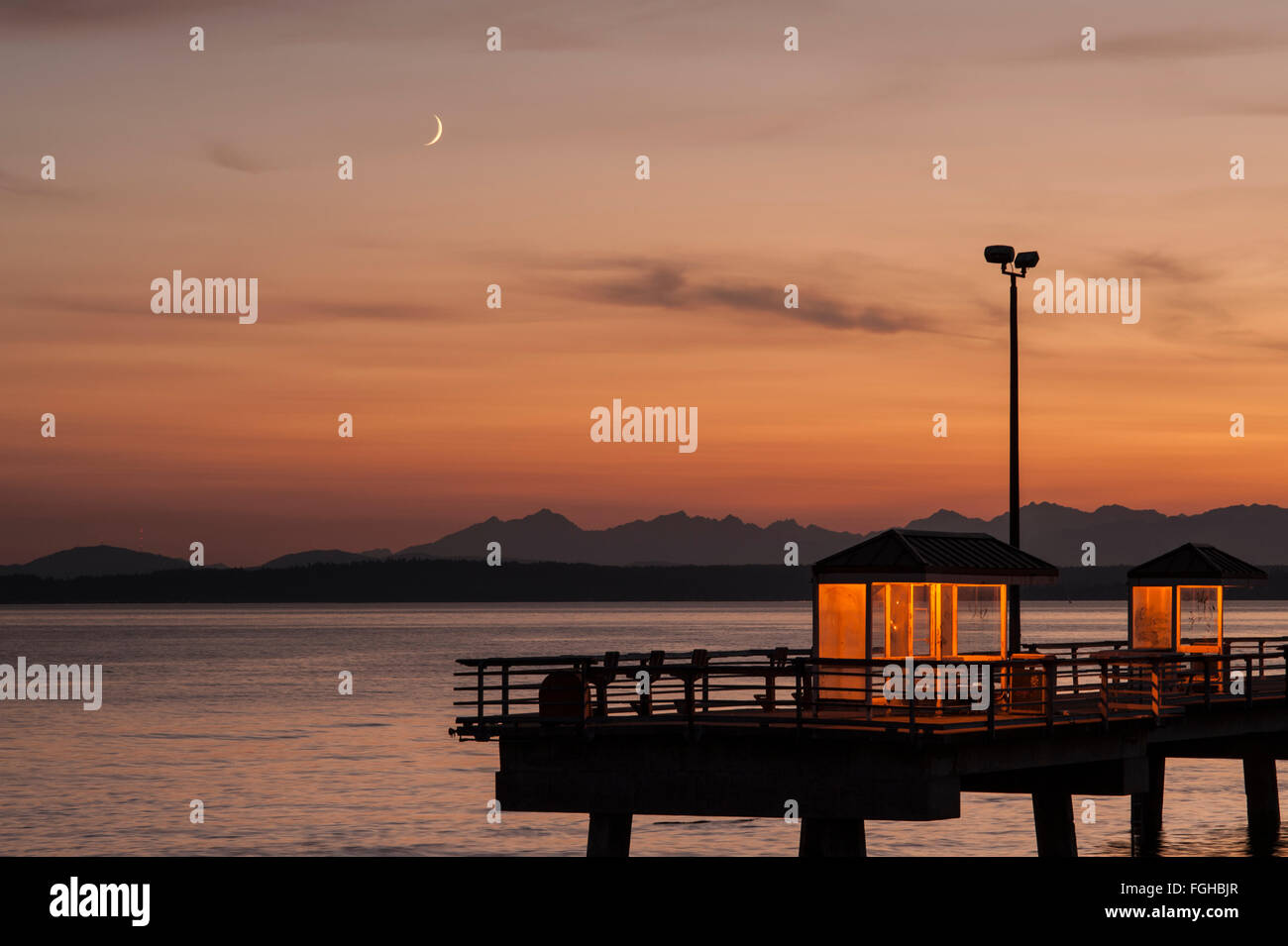 Dramatic sunset over Puget Sound and the Olympic Mountains with ...