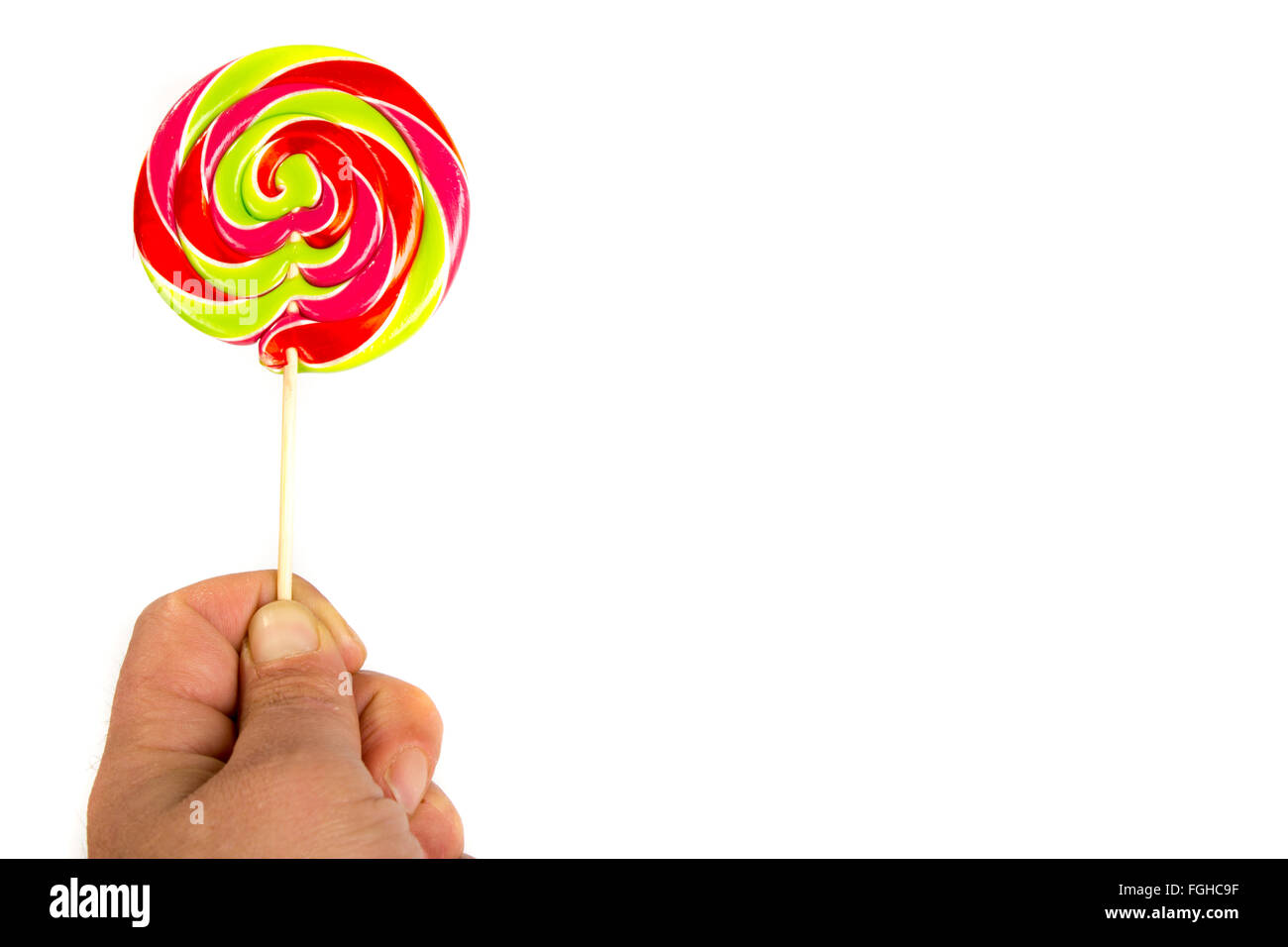 man hand holding lollipop isolated on white background Stock Photo - Alamy