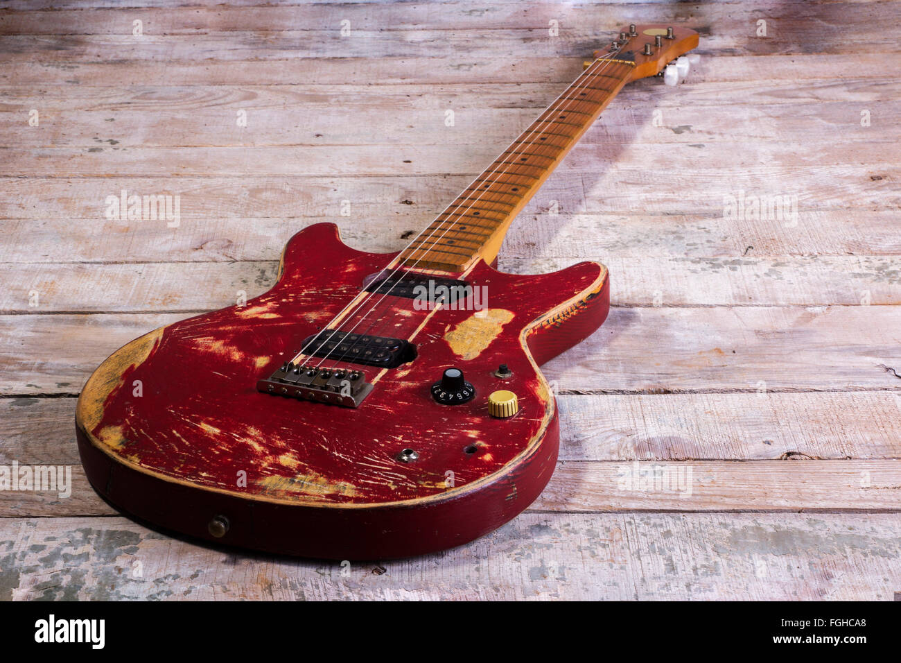 old electric guitar red retro isolated on wood Stock Photo - Alamy