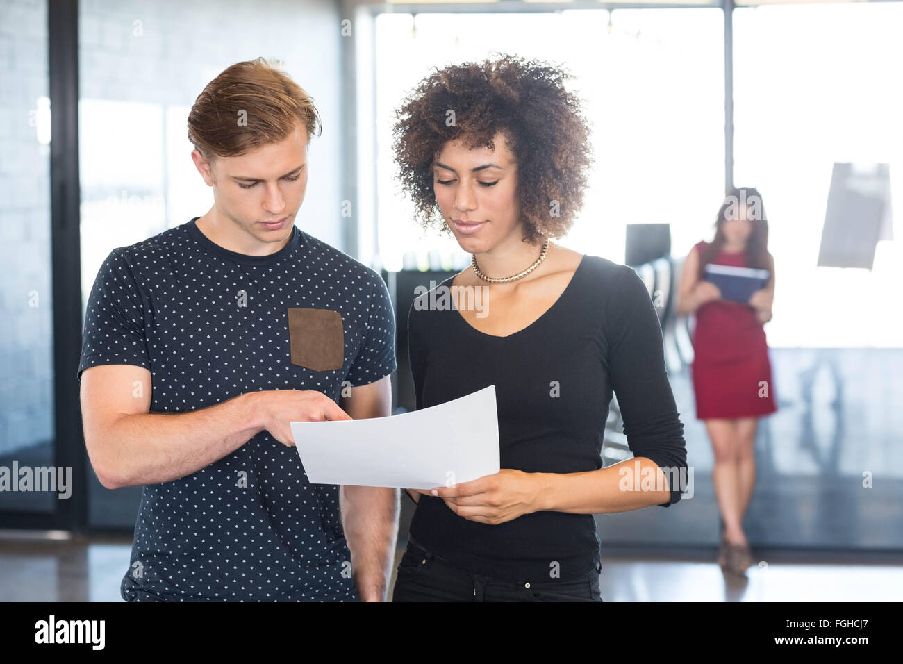 Business partners reading document hi-res stock photography and images ...