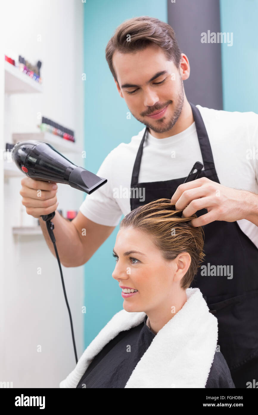 Woman hairdresser drying male hi-res stock photography and images - Alamy