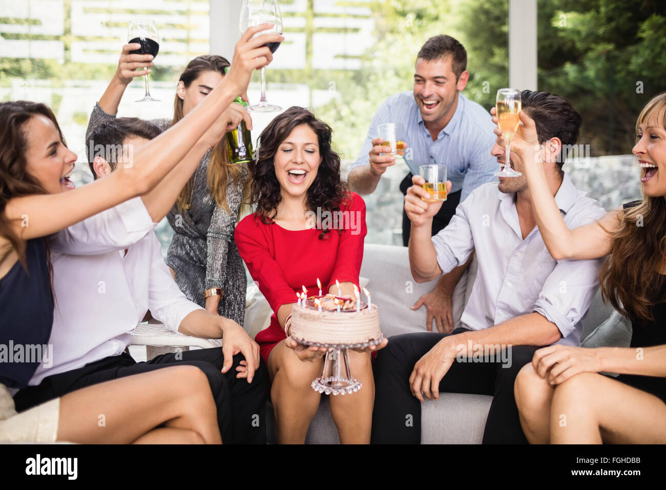 Woman celebrating her birthday with friends Stock Photo - Alamy