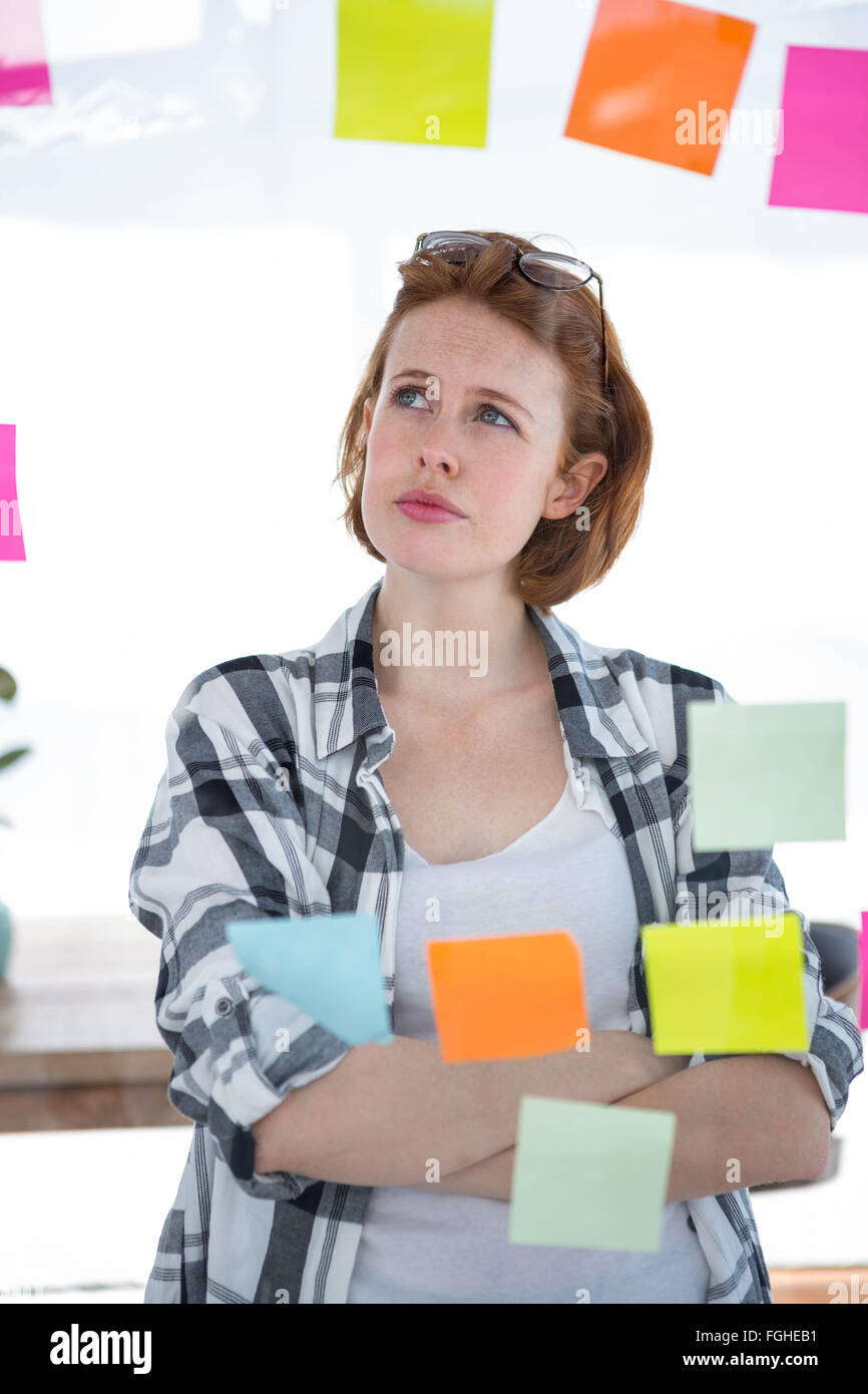thoughtful hipster woman brainstorming over notes Stock Photo - Alamy