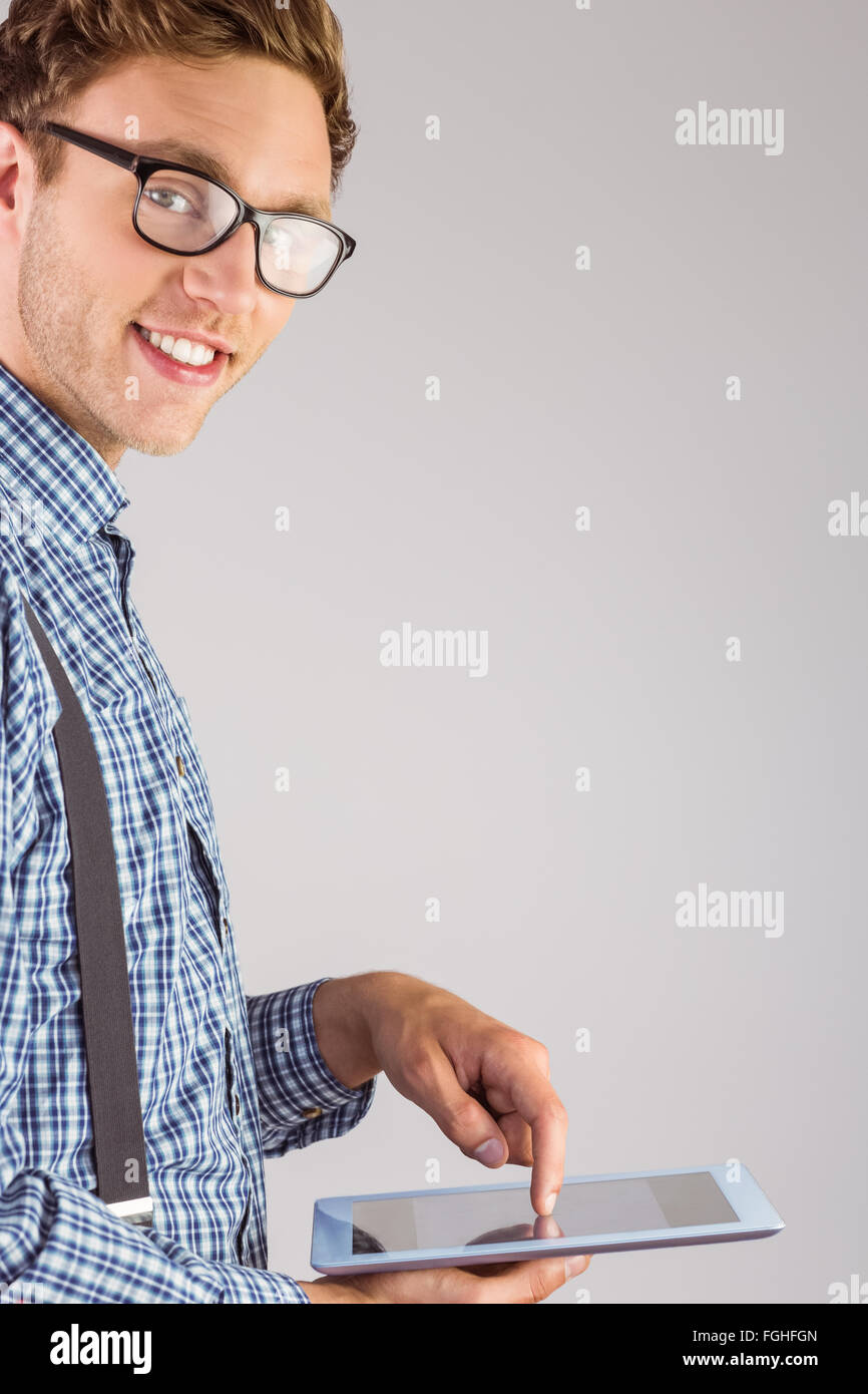 Geeky businessman using his tablet pc Stock Photo - Alamy