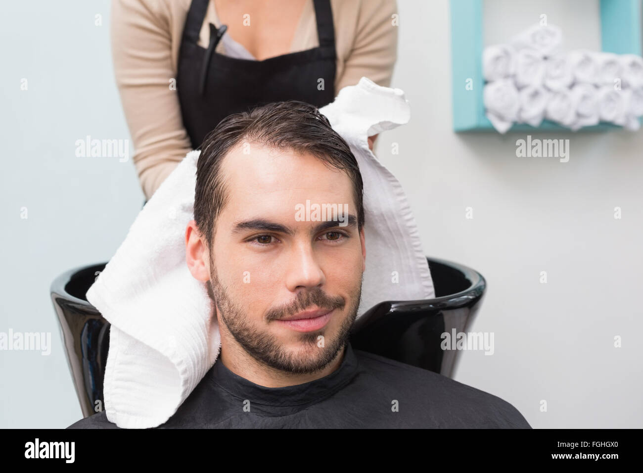 Hair stylist drying mans hair Stock Photo - Alamy