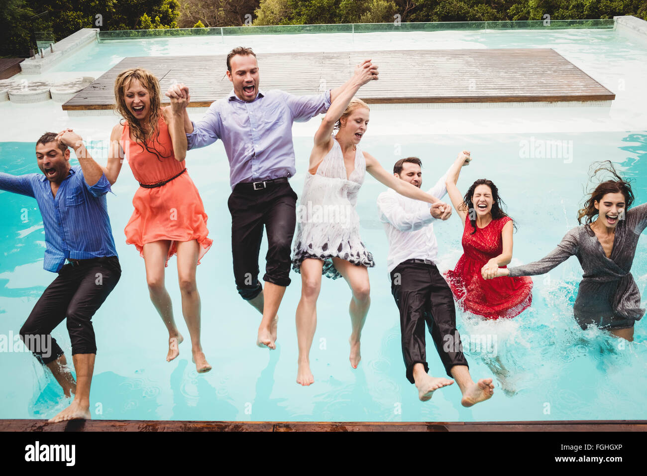 Young friends having fun at swimming pool Stock Photo - Alamy