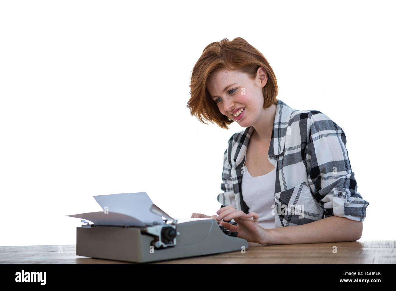 smiling hipster woman typing on her typewriter Stock Photo - Alamy