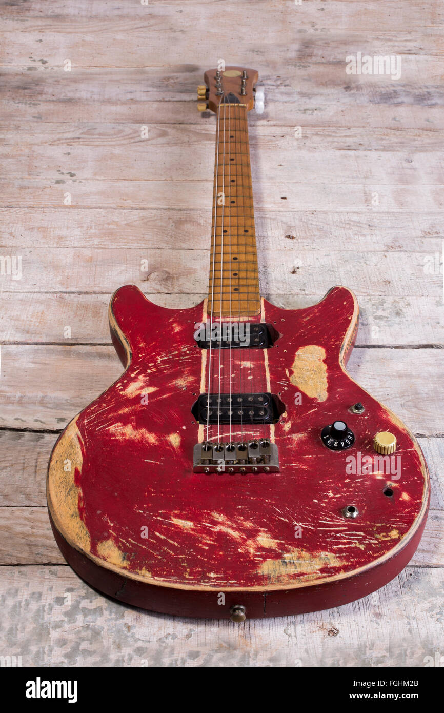 old electric guitar red retro isolated on wood Stock Photo - Alamy