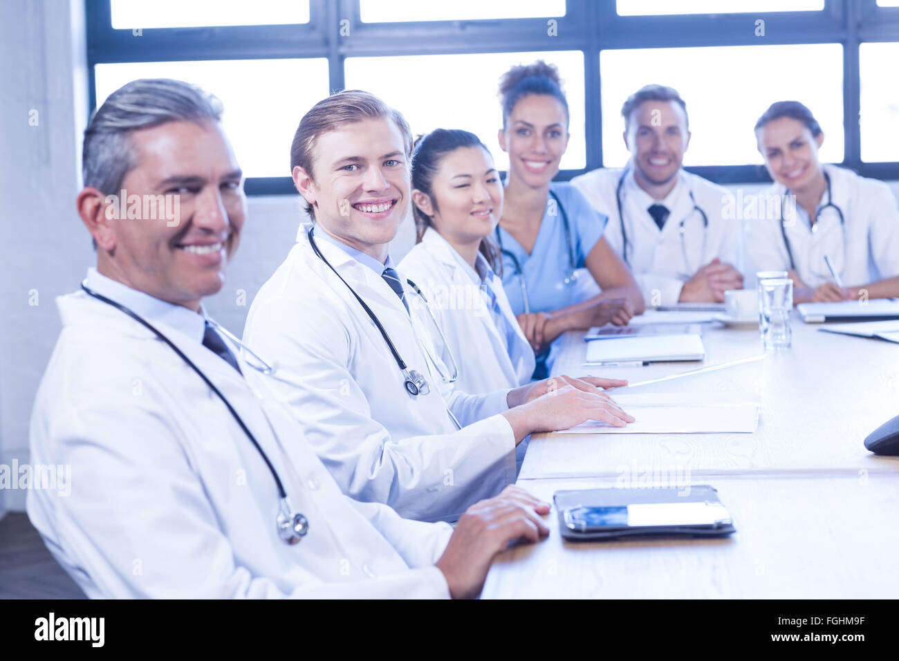 Medical team smiling at conference room Stock Photo - Alamy
