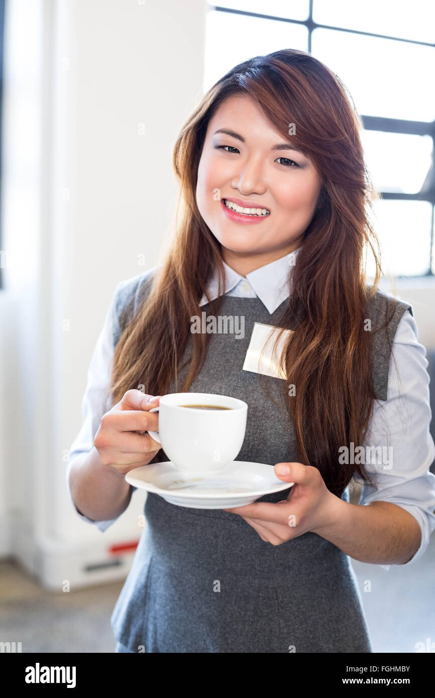 Businesswoman having a cup of tea Stock Photo - Alamy