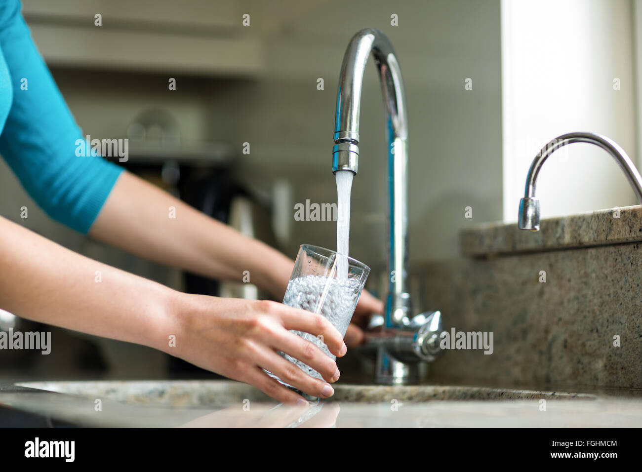 Woman pouring water glass hi-res stock photography and images - Alamy