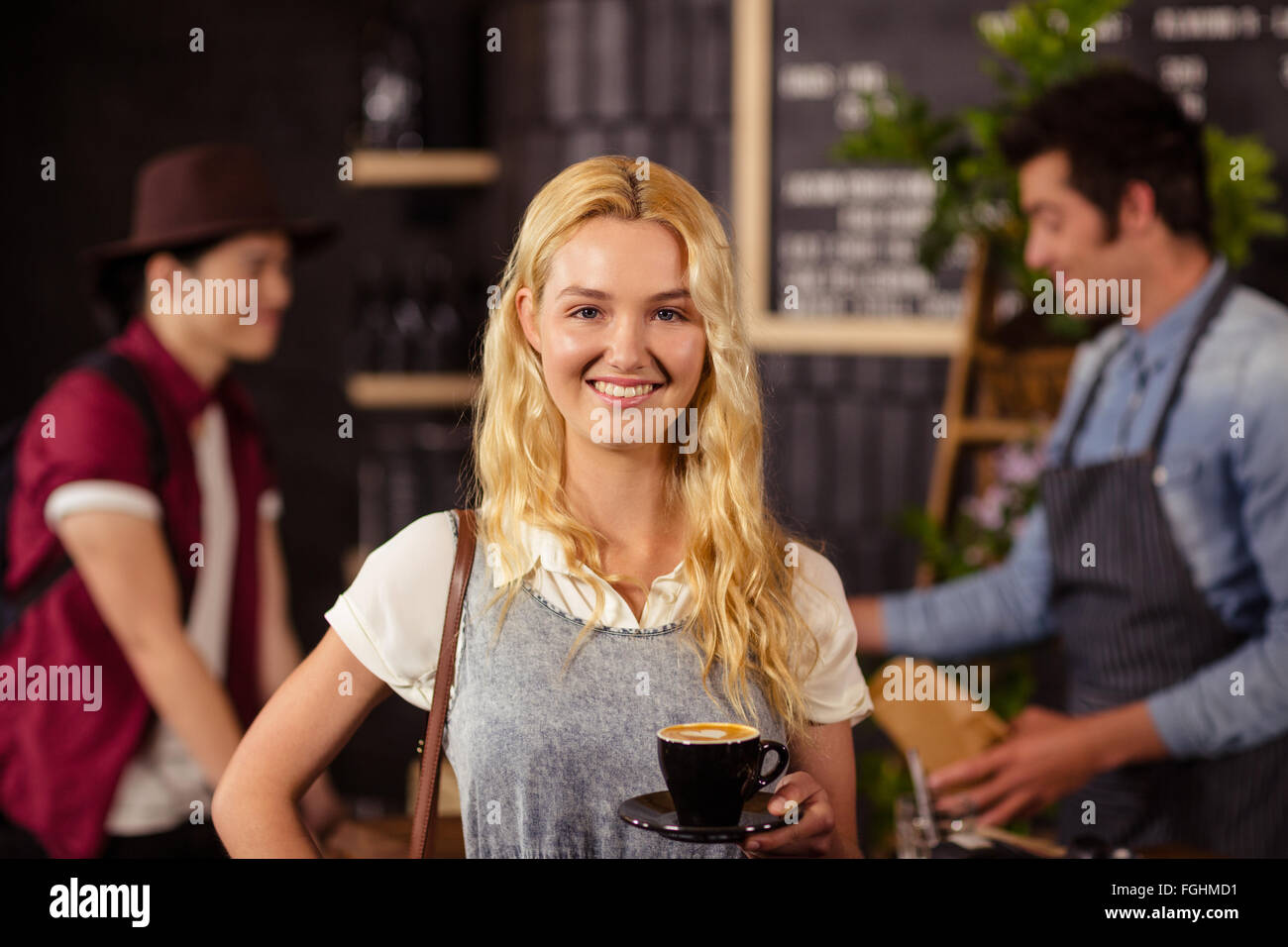 Portrait of smiling pretty customer holding cup of coffee Stock Photo ...