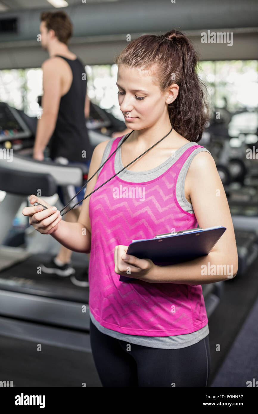 Female trainer smiling to camera Stock Photo - Alamy
