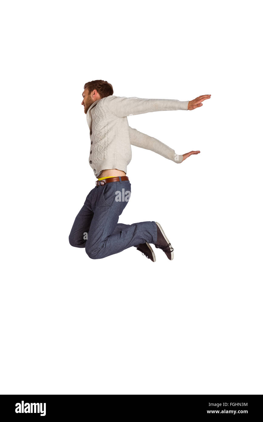 Full length of cheerful young man jumping Stock Photo - Alamy