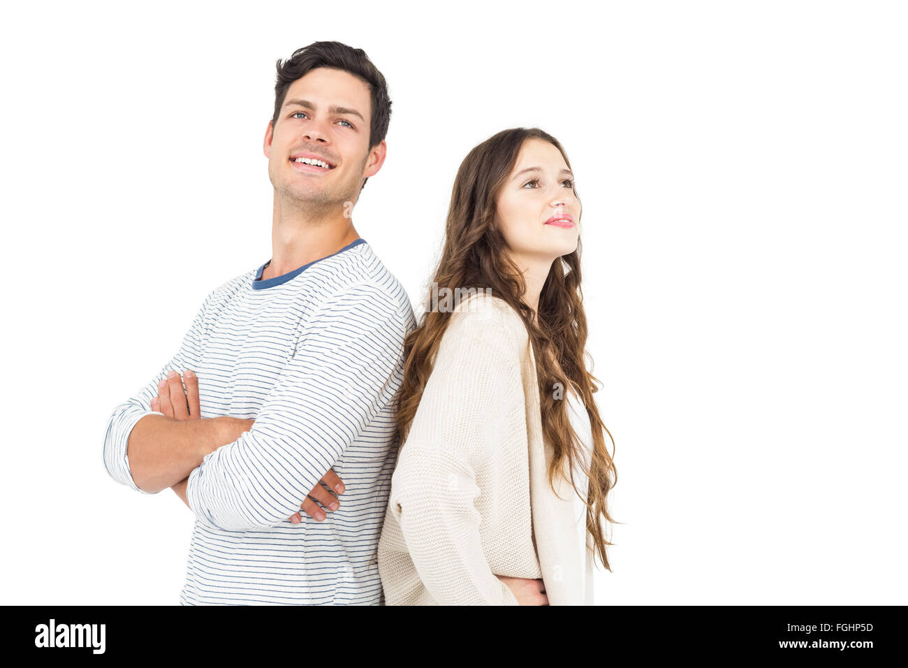 Couple standing back to back Stock Photo - Alamy
