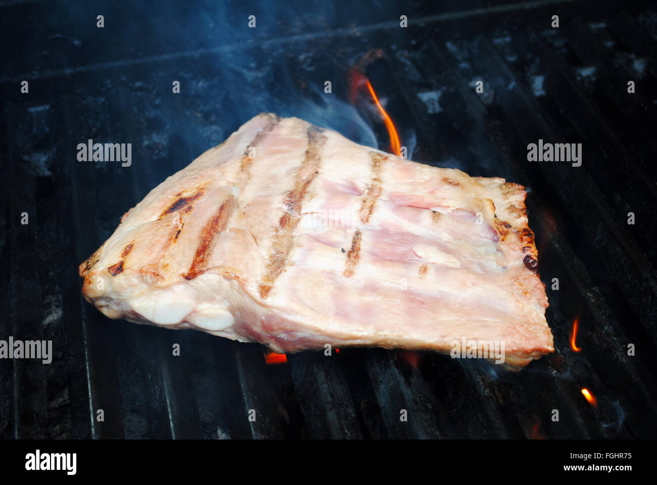 Grilling a Slab of Baby Back Ribs Stock Photo - Alamy
