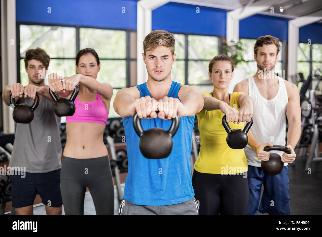 Fitness class lifting dumbbells Stock Photo - Alamy