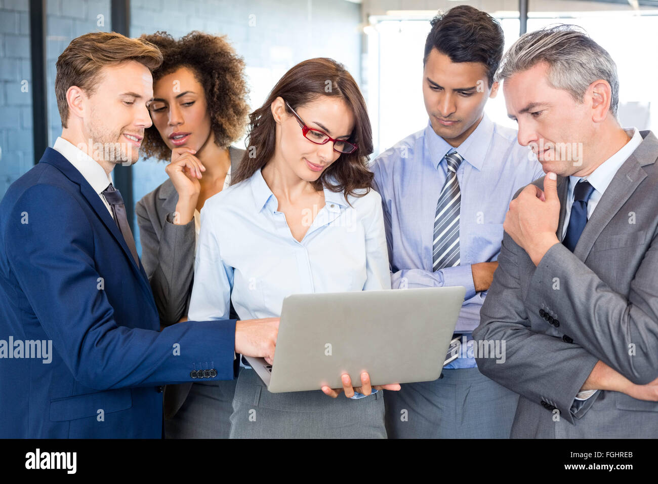 Business team interacting in office Stock Photo - Alamy