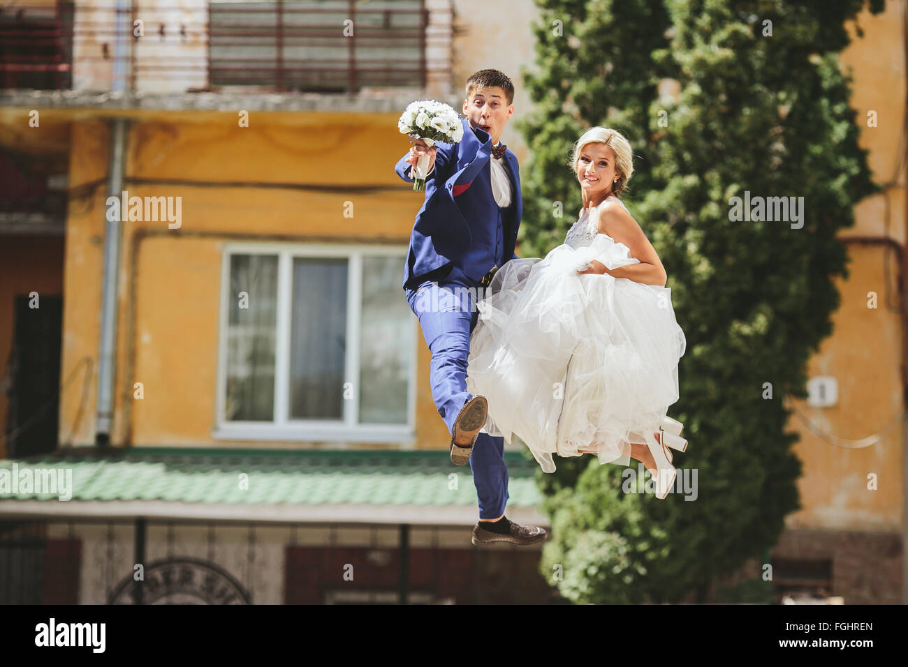 Happy wedding jumping groom hi-res stock photography and images - Alamy