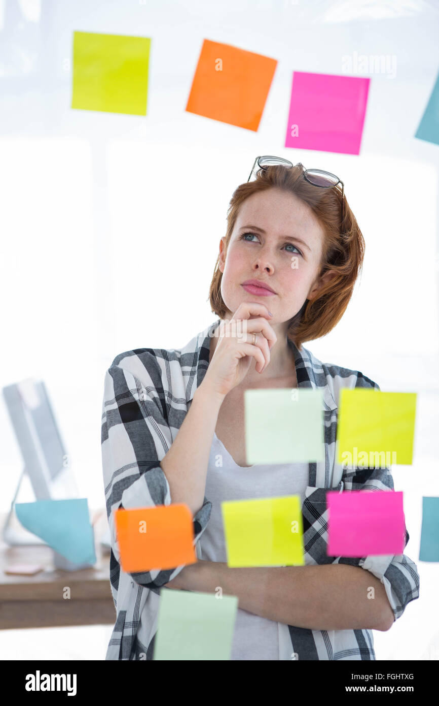 thoughtful hipster woman brainstorming over notes Stock Photo - Alamy