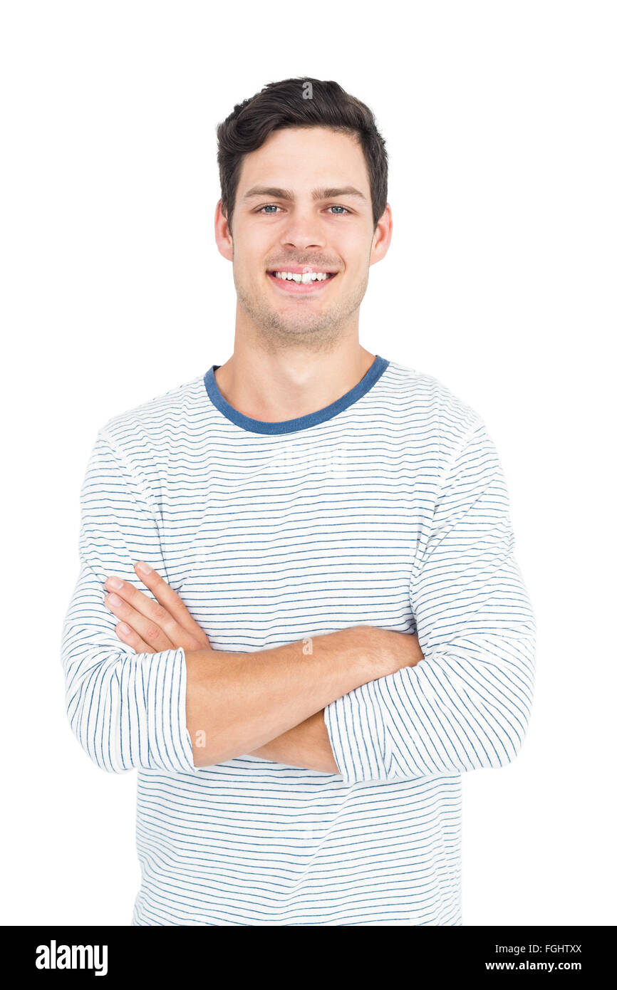 Smiling man with arm crossed Stock Photo - Alamy