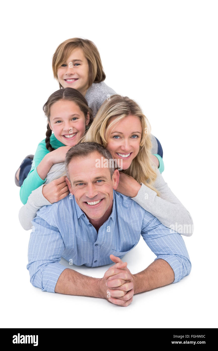 Happy family members lying on each other Stock Photo - Alamy